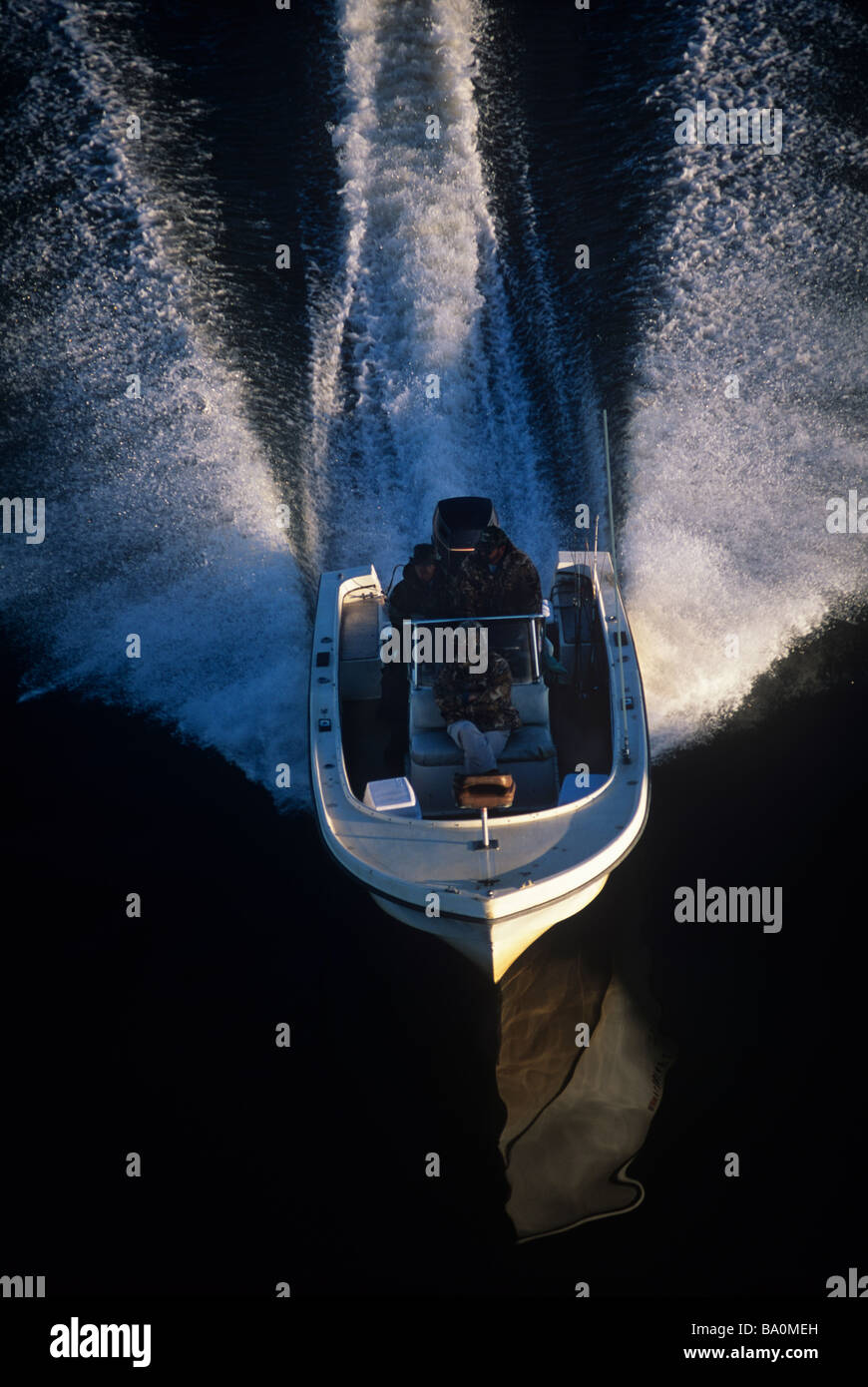 Small outboard boat running in Apalachicola Bay Florida Stock Photo - Alamy
