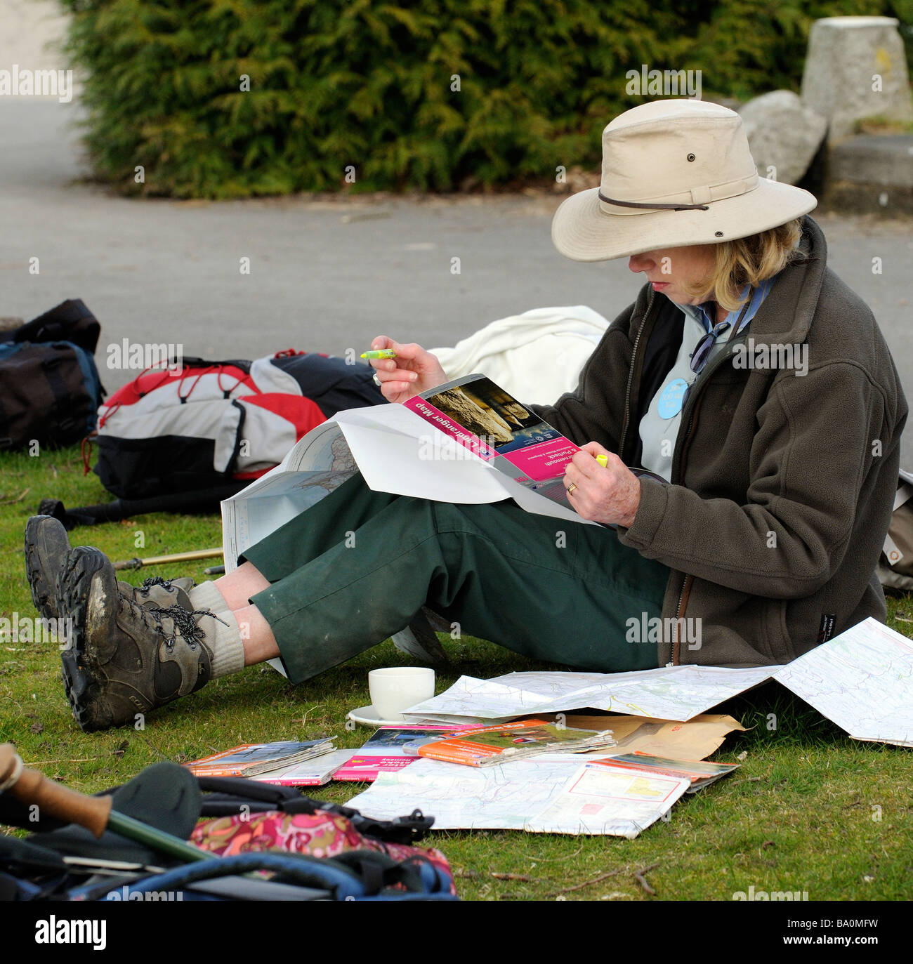 Female walker checking map hi-res stock photography and images - Alamy
