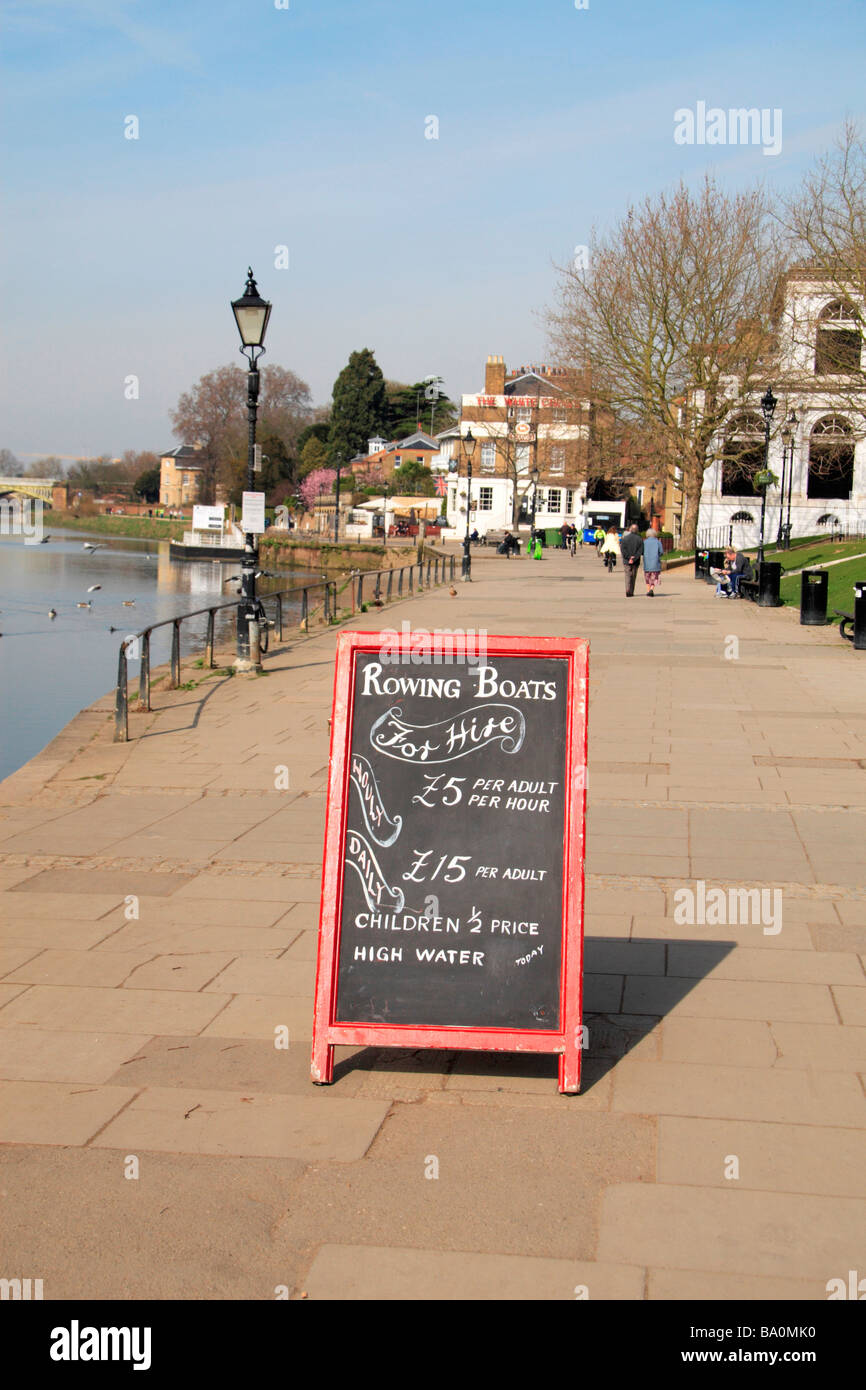 A rowing boats for hire advertising board on the Thames Path close to ...