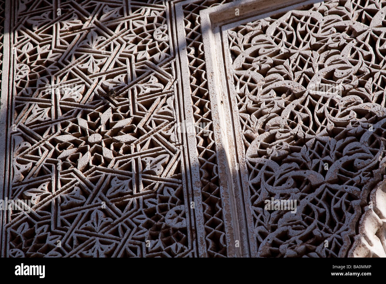 Traditional detailed islamic patterns in the stone carvings of a wall ...