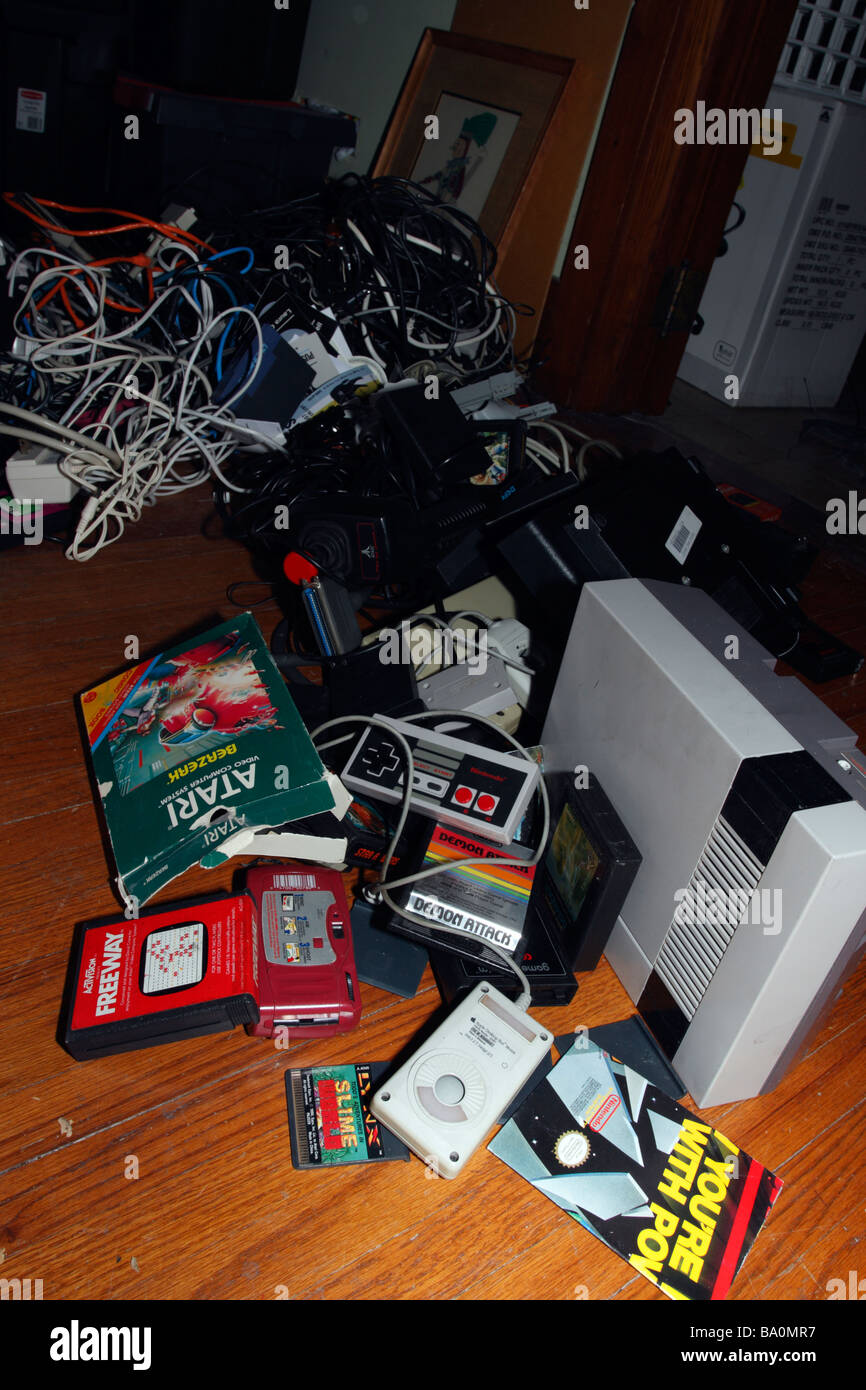 Assorted video game consoles, controllers, and cartridges Stock Photo ...