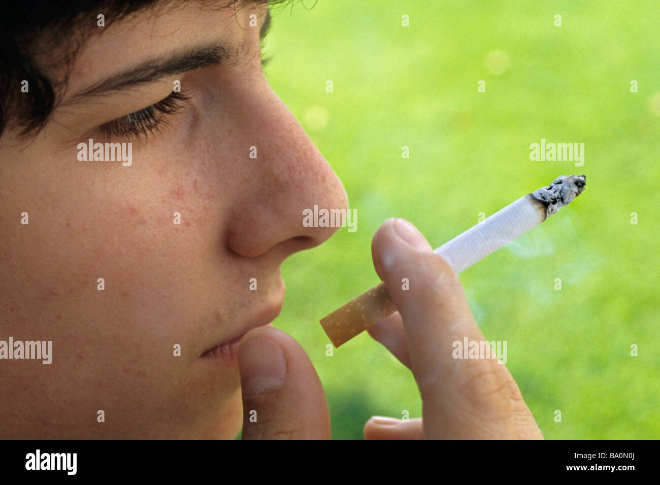 Hand lighted cigarette smoke hi-res stock photography and images - Alamy