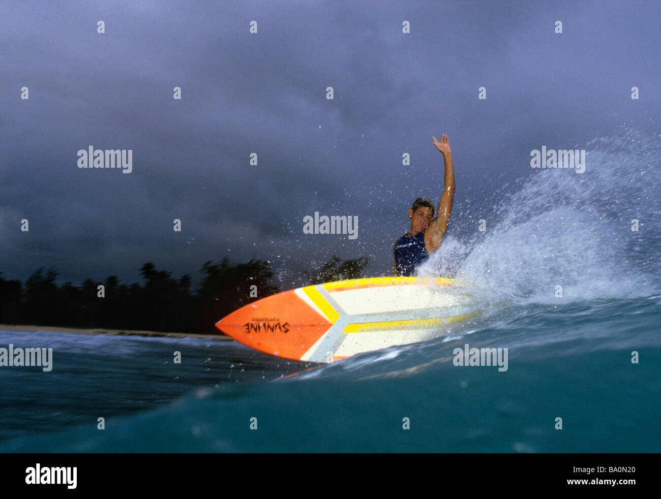 Surfer cutting back in the early eavning at Brandon on the south coast ...