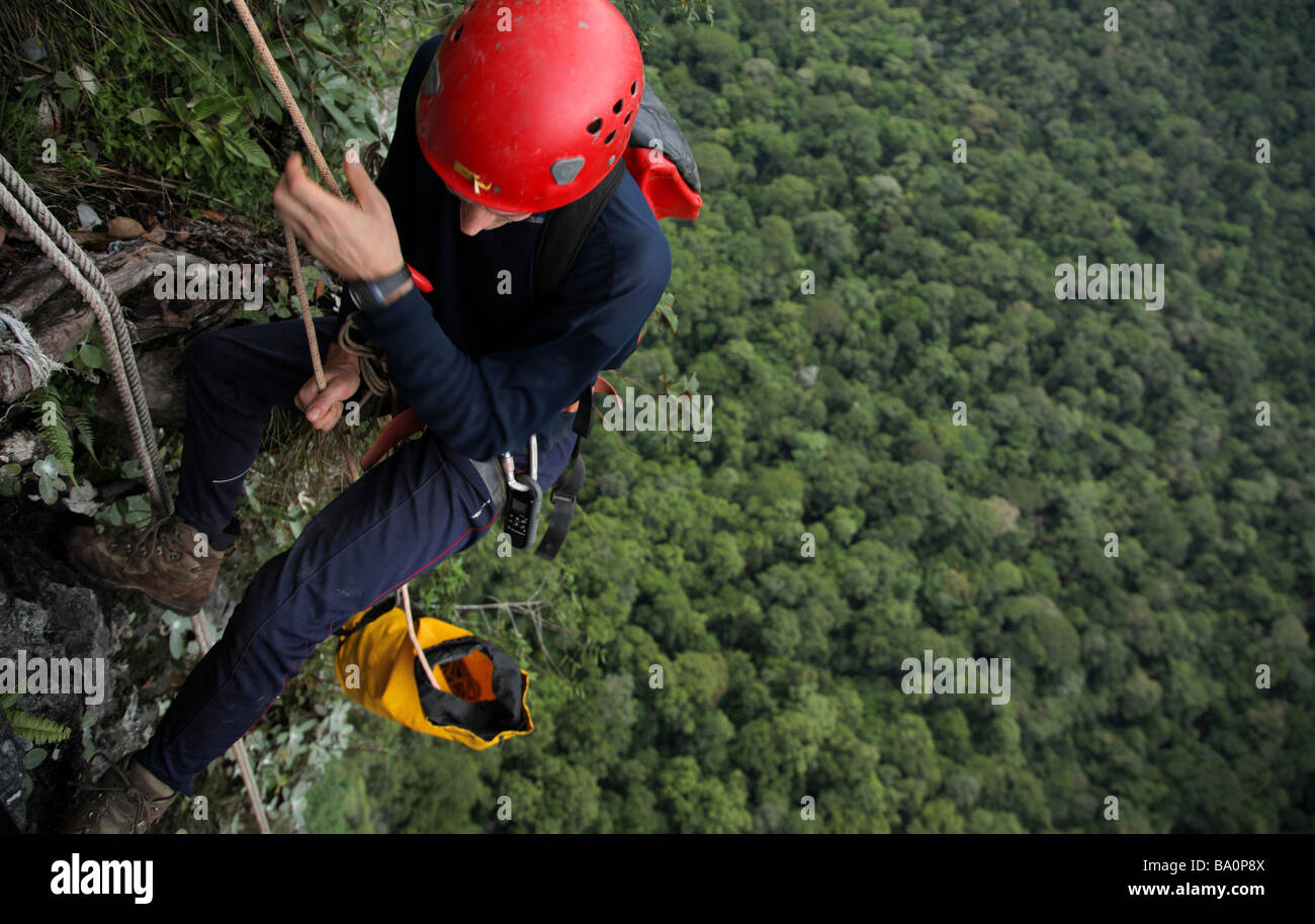 Abseiling into an isolated cave in Mulu National Park, Sarawak Borneo ...