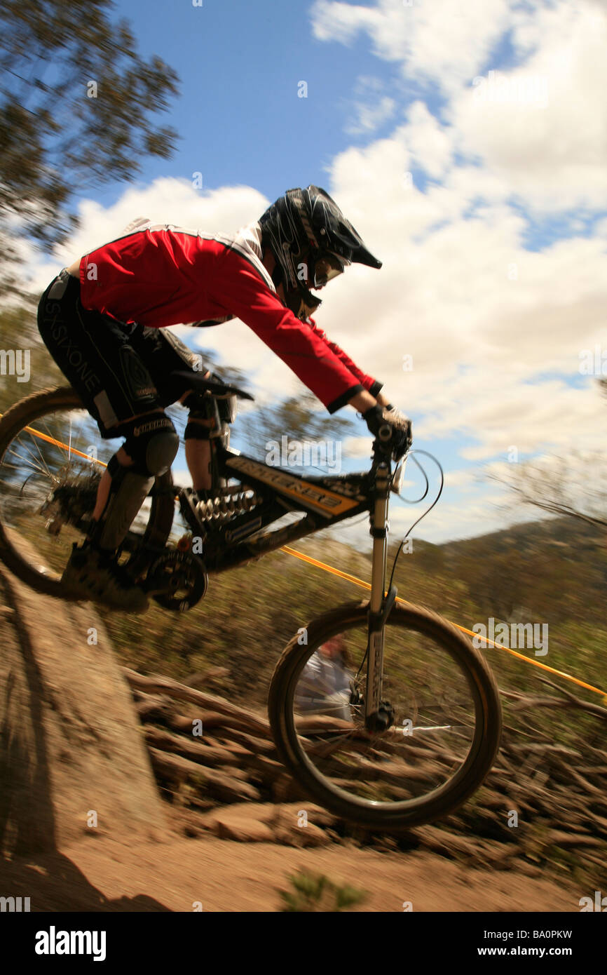 A mounatin biker rides over extreme obstacles Stock Photo - Alamy