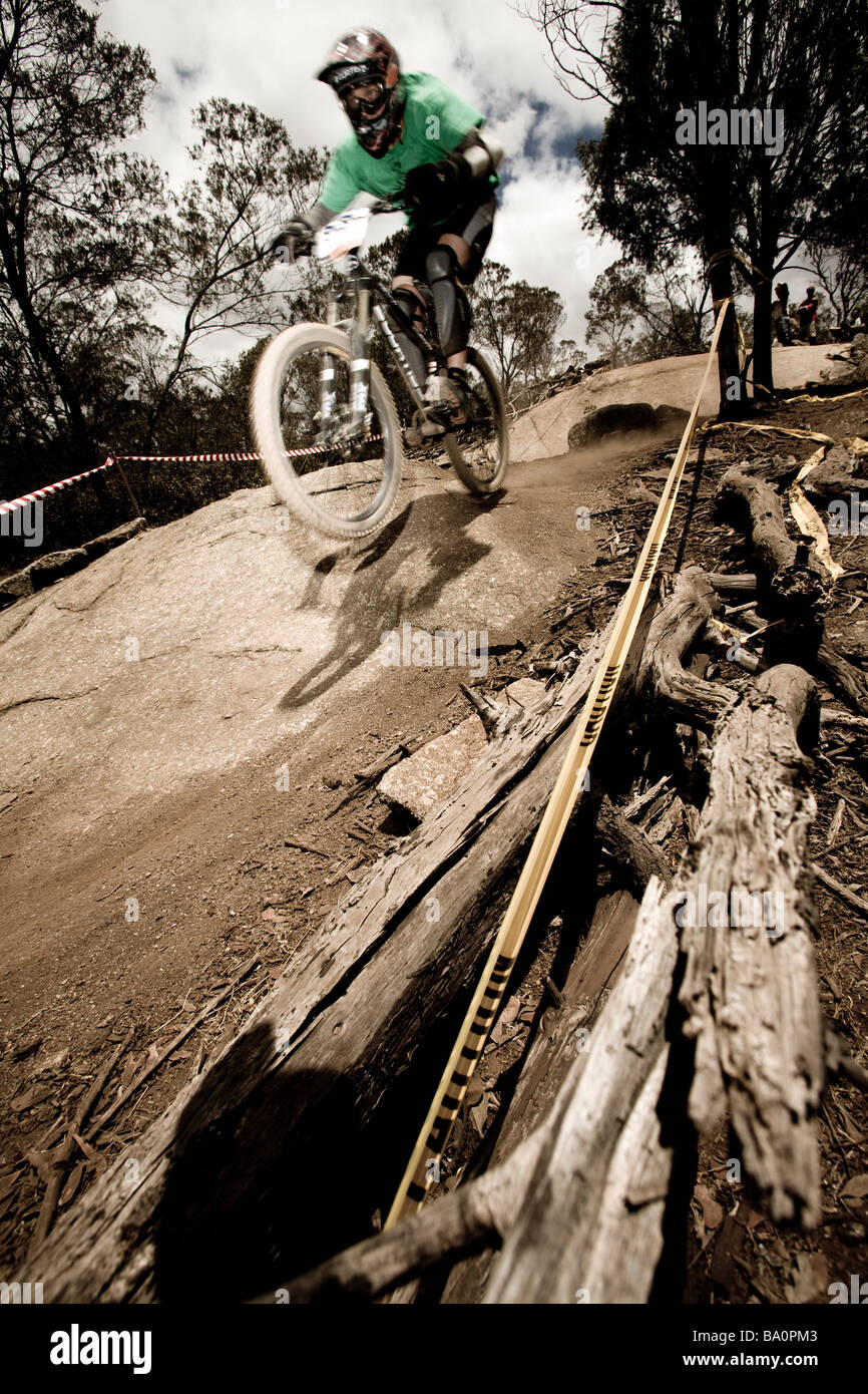 A mounatin biker rides over extreme obstacles Stock Photo - Alamy