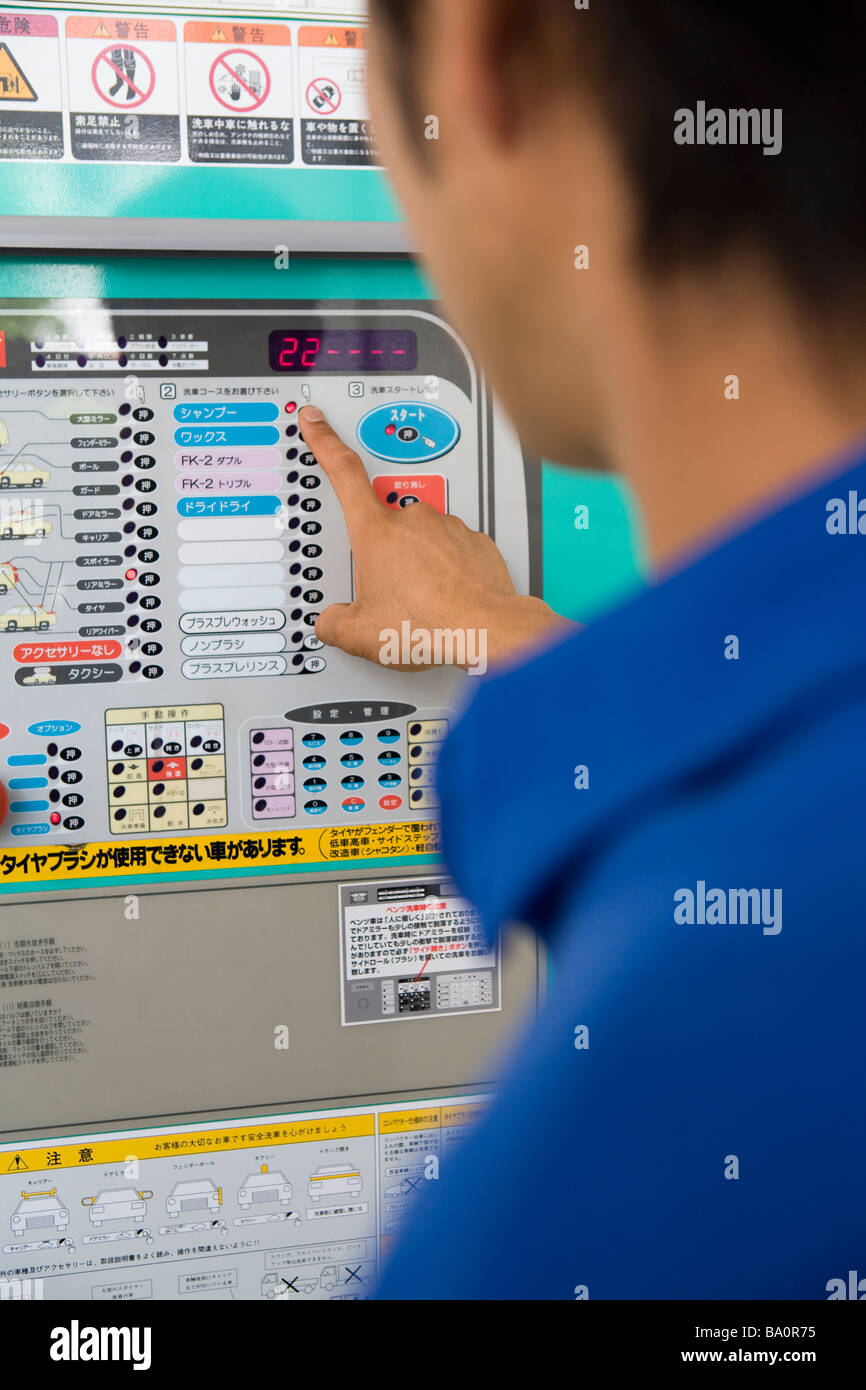 Gas station clerk operating machine Stock Photo - Alamy