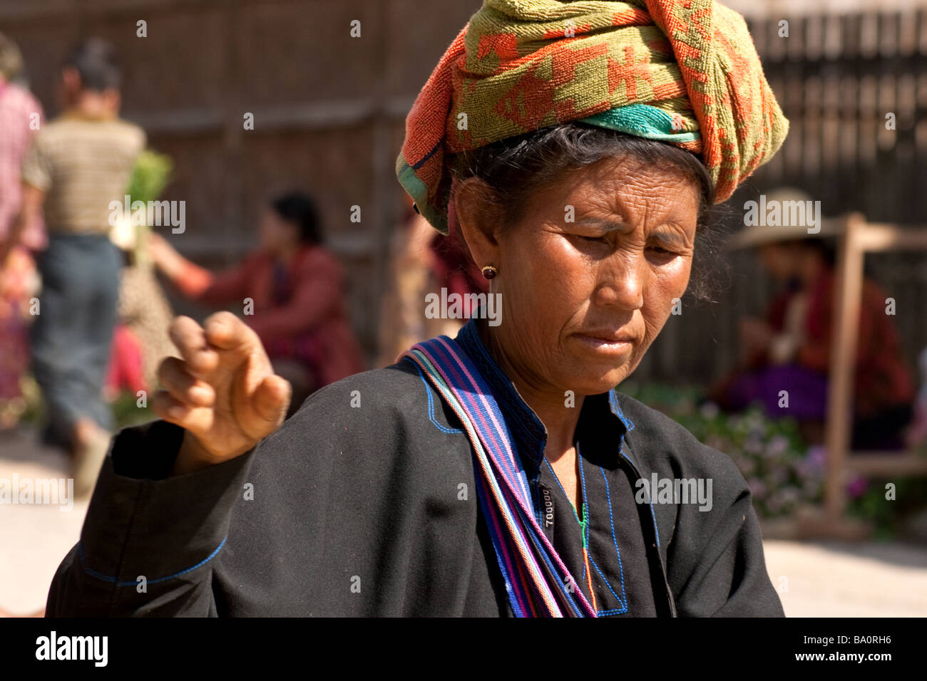 Gesturing Pa-O tribal woman at Aungban market in Shan State, Myanmar ...