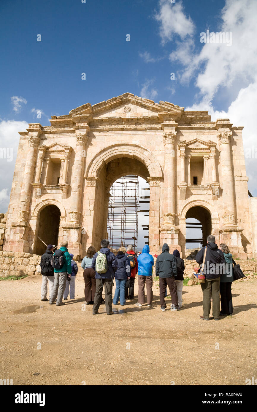 Tourists view Hadrians Arch, the Roman town of Jerash, Jordan Stock ...