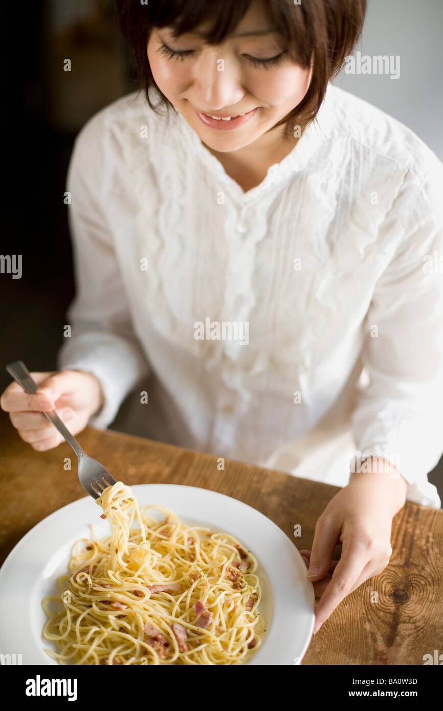 Woman eating spaghetti shirt hi-res stock photography and images - Alamy