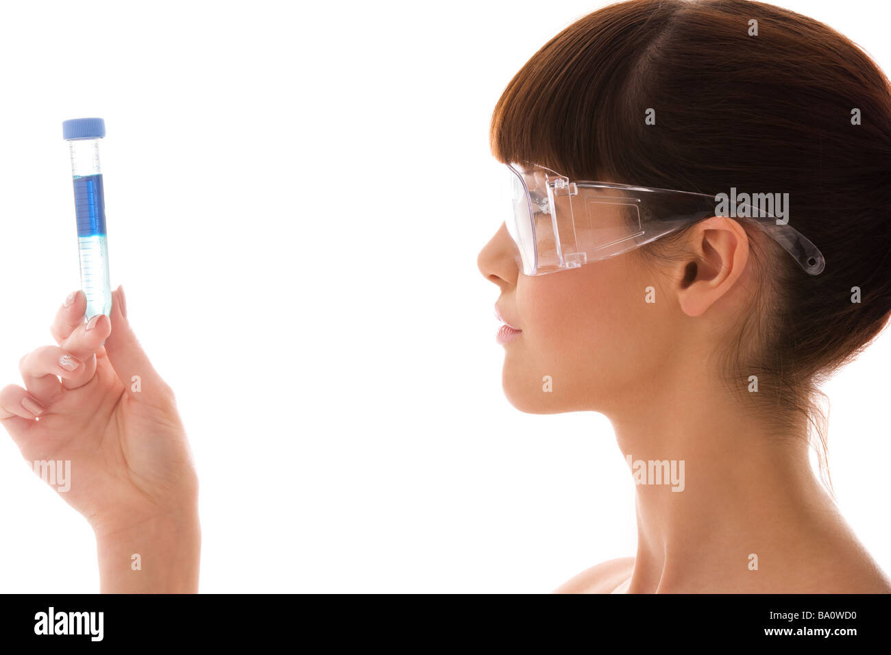beautiful female lab worker holding up test tube Stock Photo - Alamy