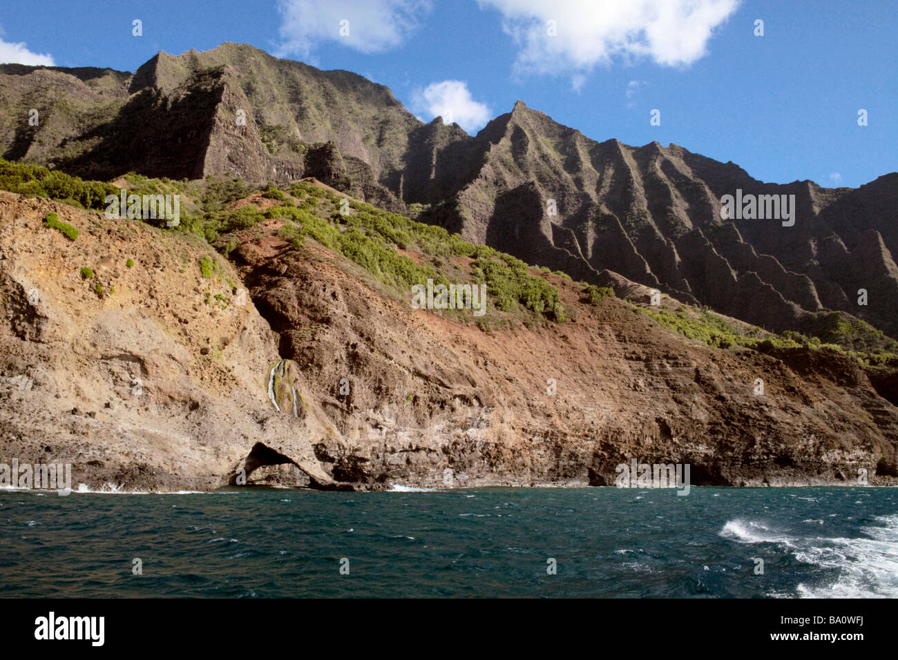 Cliffs and waterfall near Kalalau Beach Na Pali Coast Kauai HI Stock ...