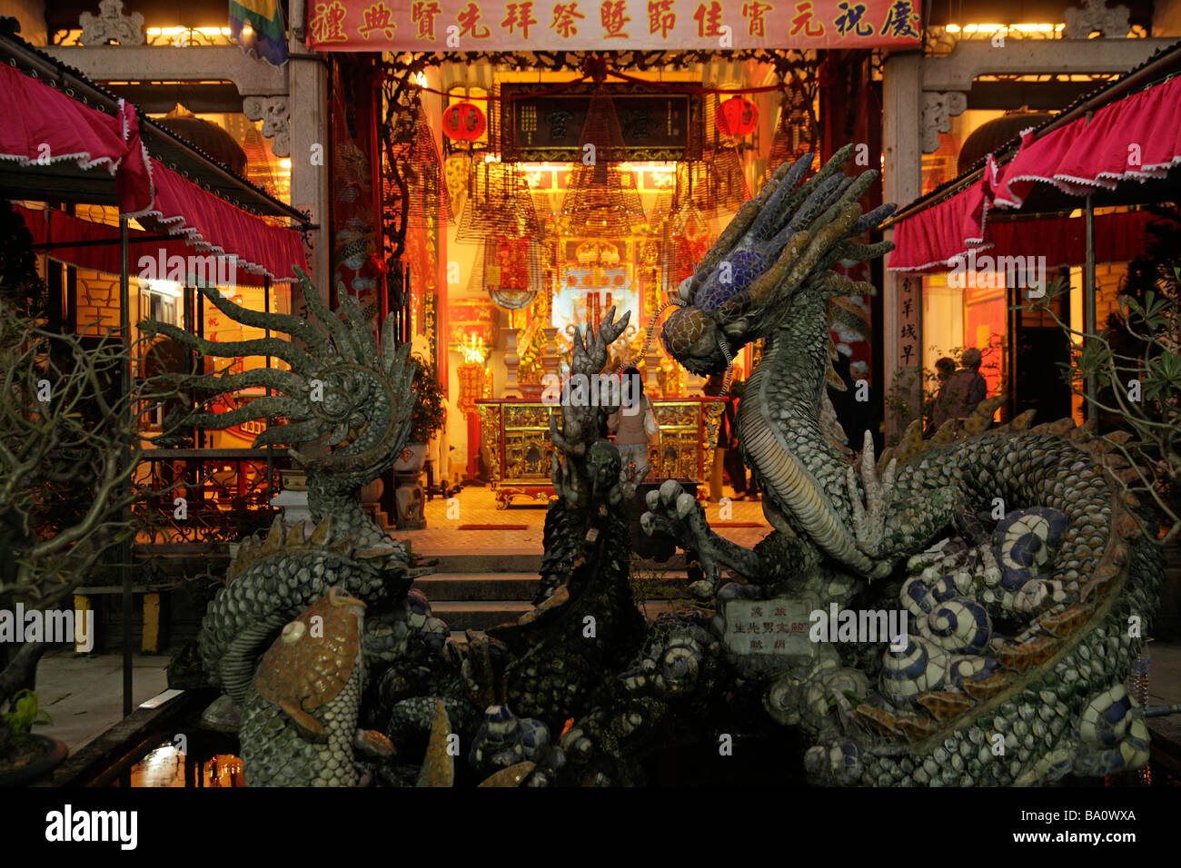 dragon in front of the illuminated Assembly Hall of the Cantonese ...