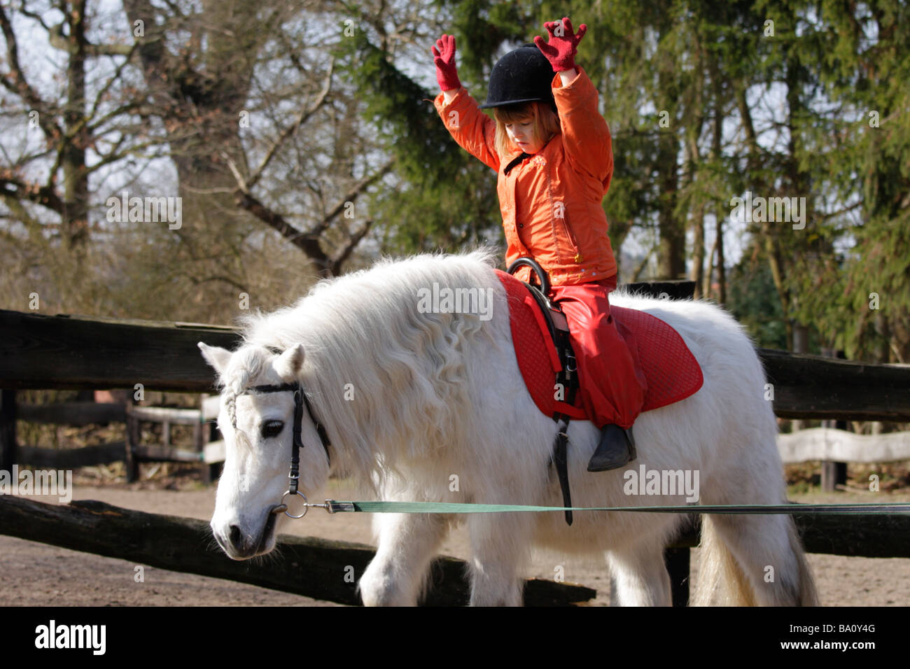 a young girl riding a pony Stock Photo - Alamy