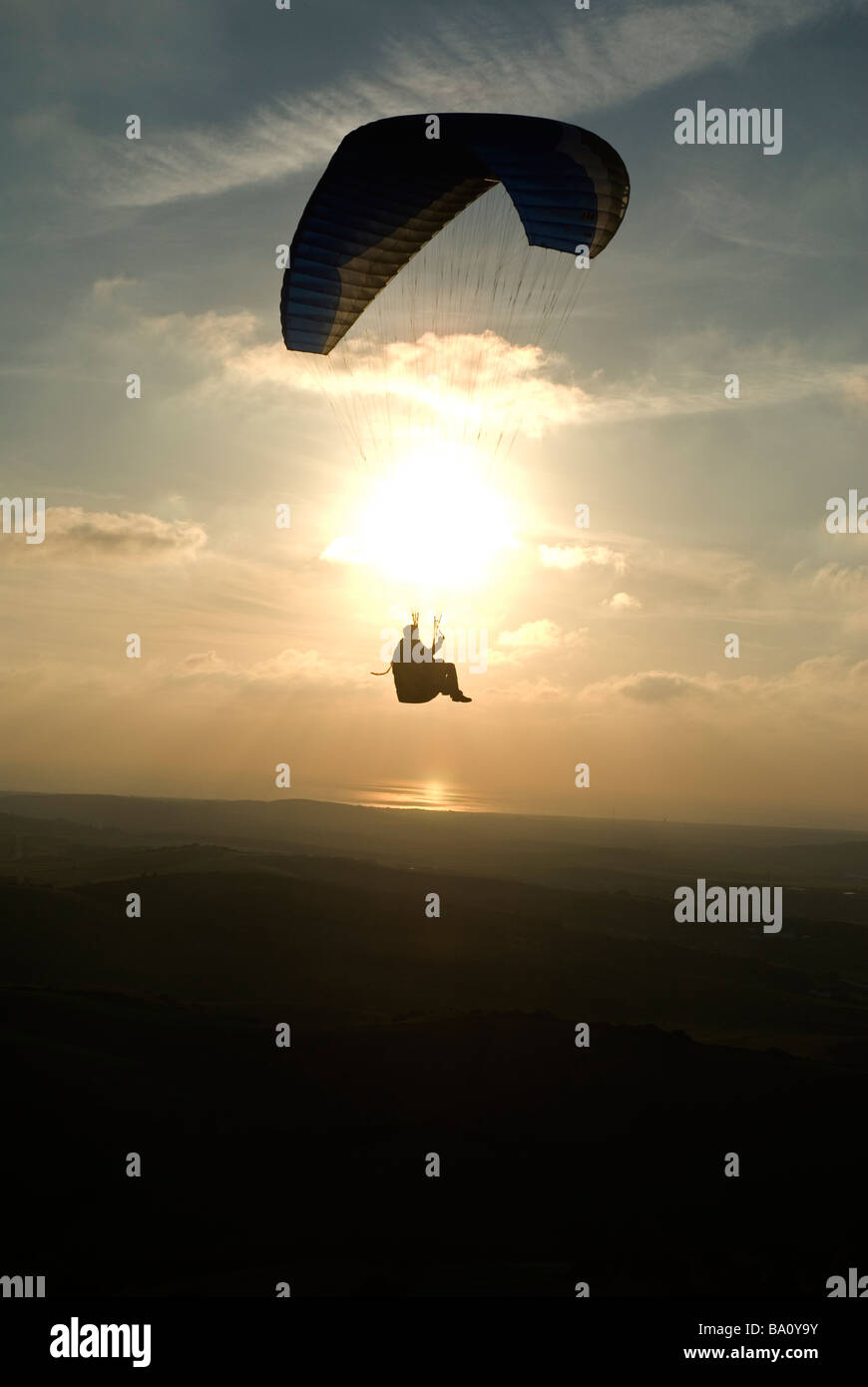 Para glider in silhouette flying at sunset Stock Photo - Alamy