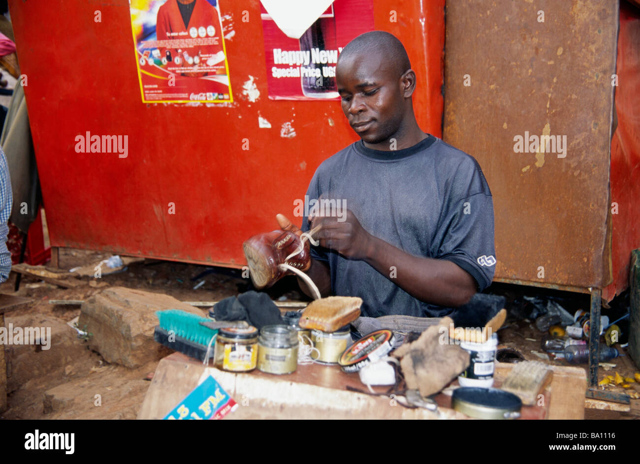 African workshop of cleaning and repairing shoes Stock Photo - Alamy