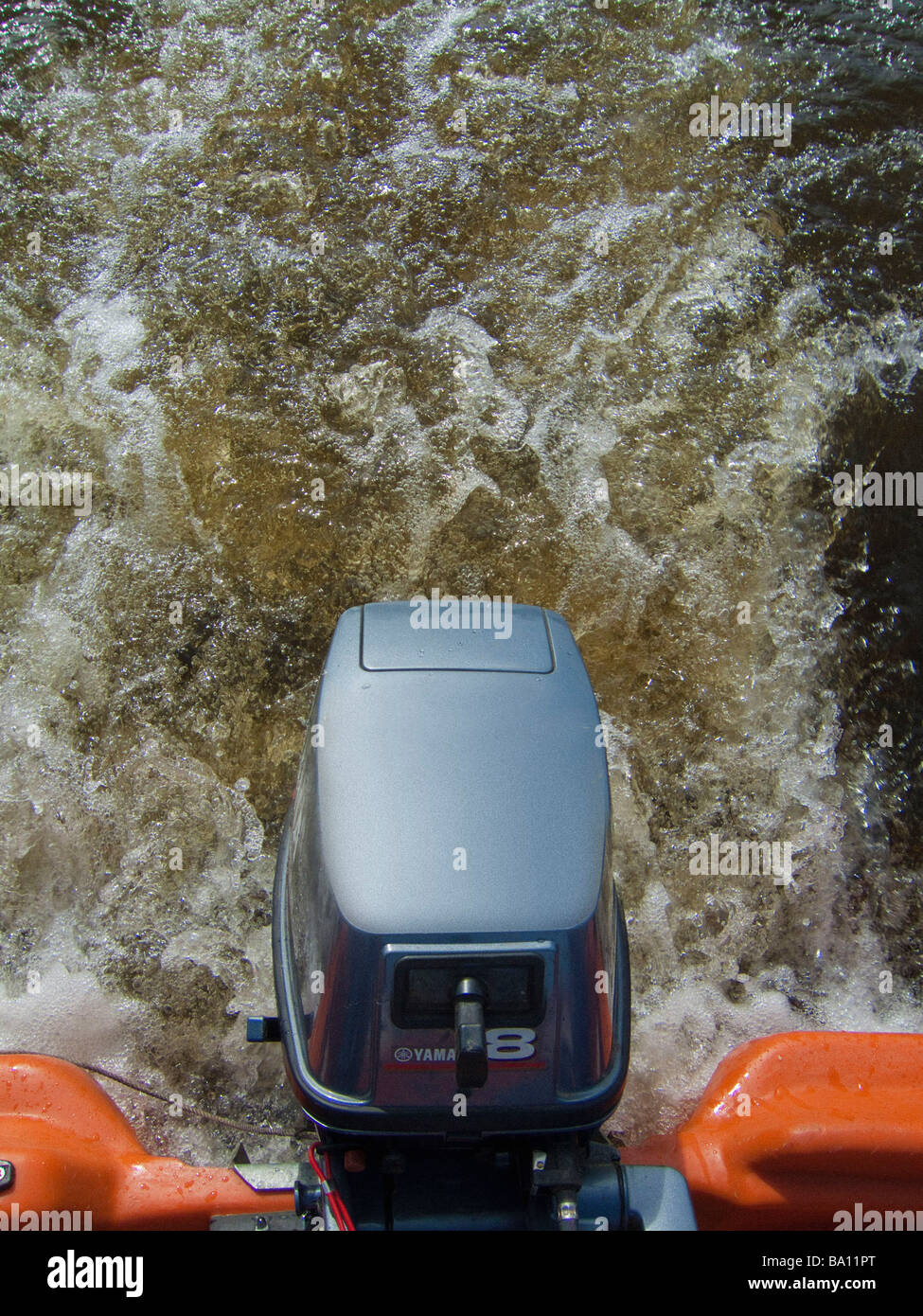 outboard motor engine on speedboat showing wash which causes damage to ...