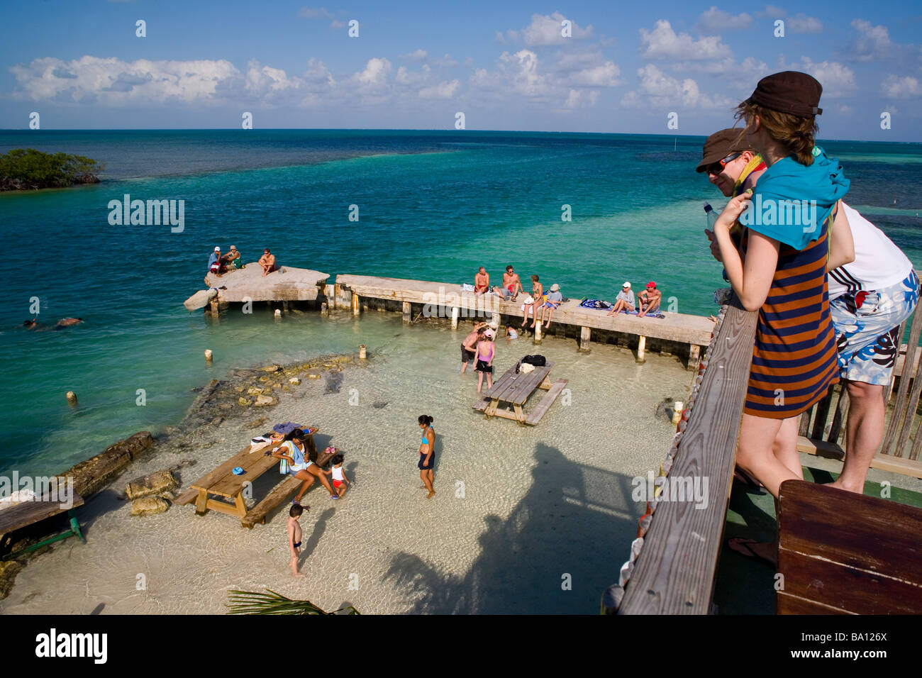 Tourists Sunbathing And Relaxing Under Strong Sunlight At The Tropical ...