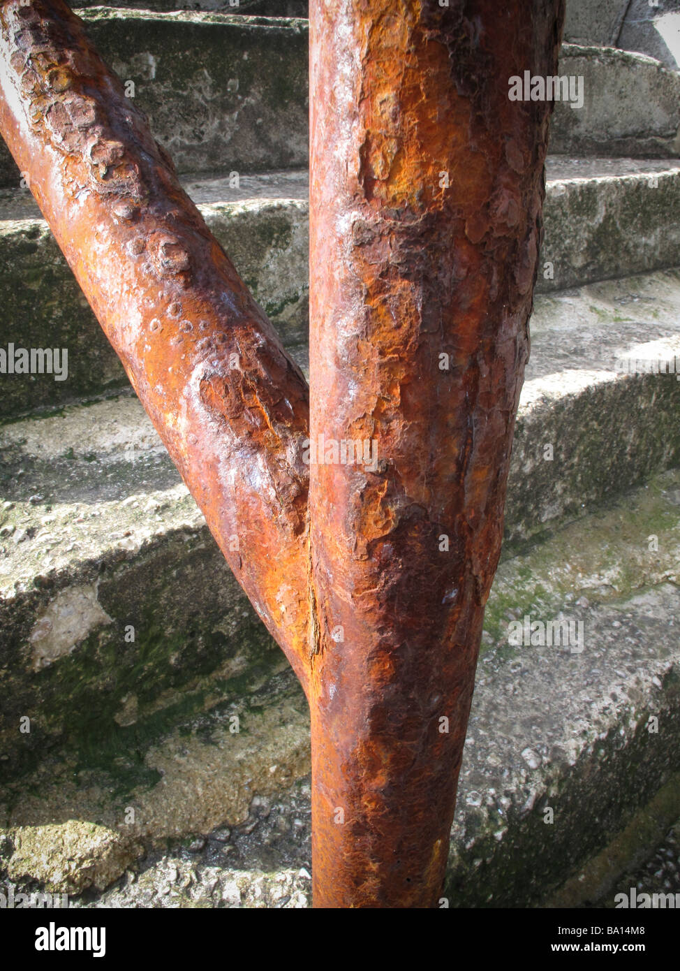 Heavily corroded steel stair railing Stock Photo - Alamy