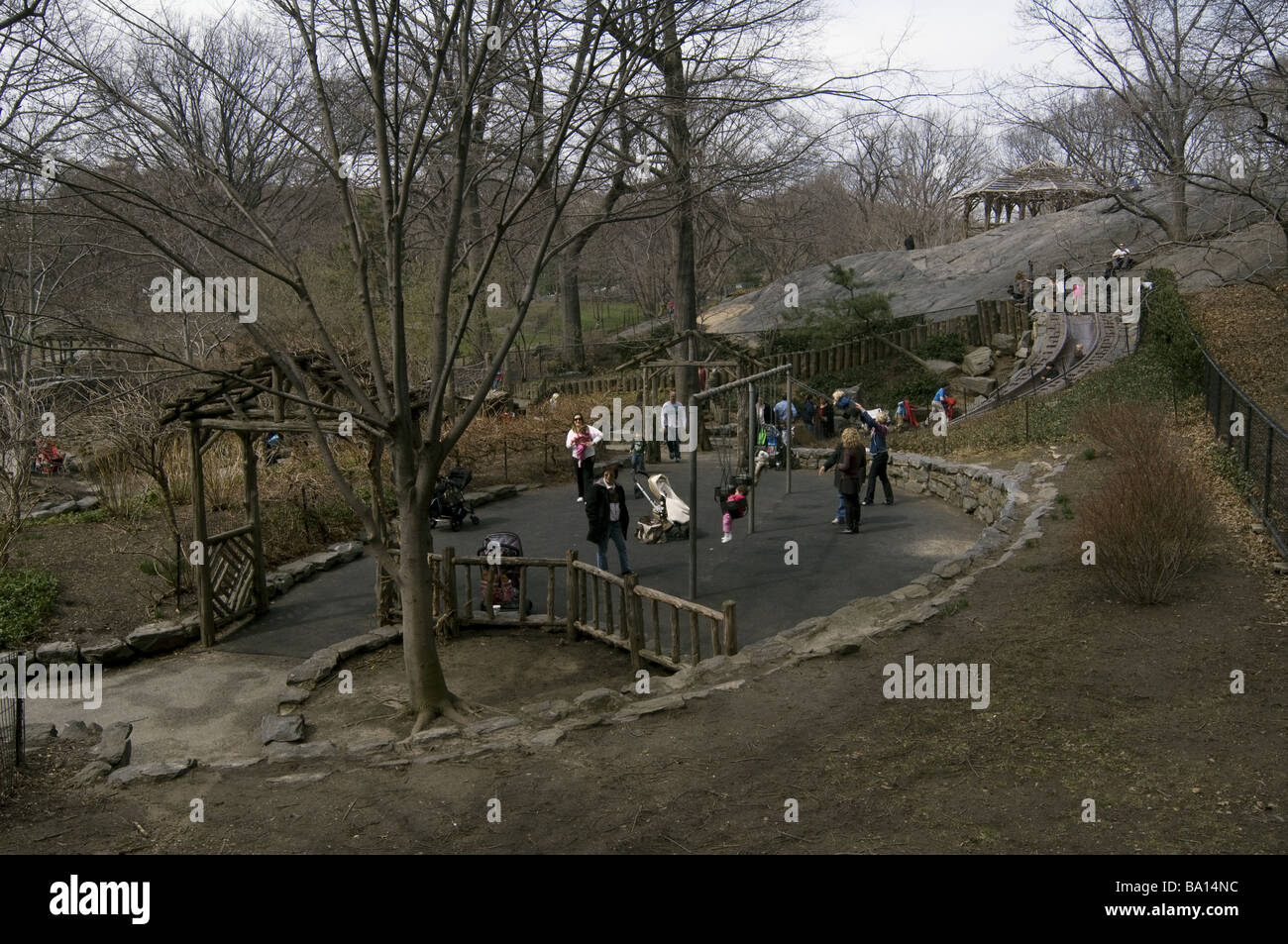 Kids enjoying spring weather in a Central Park New York City playground ...