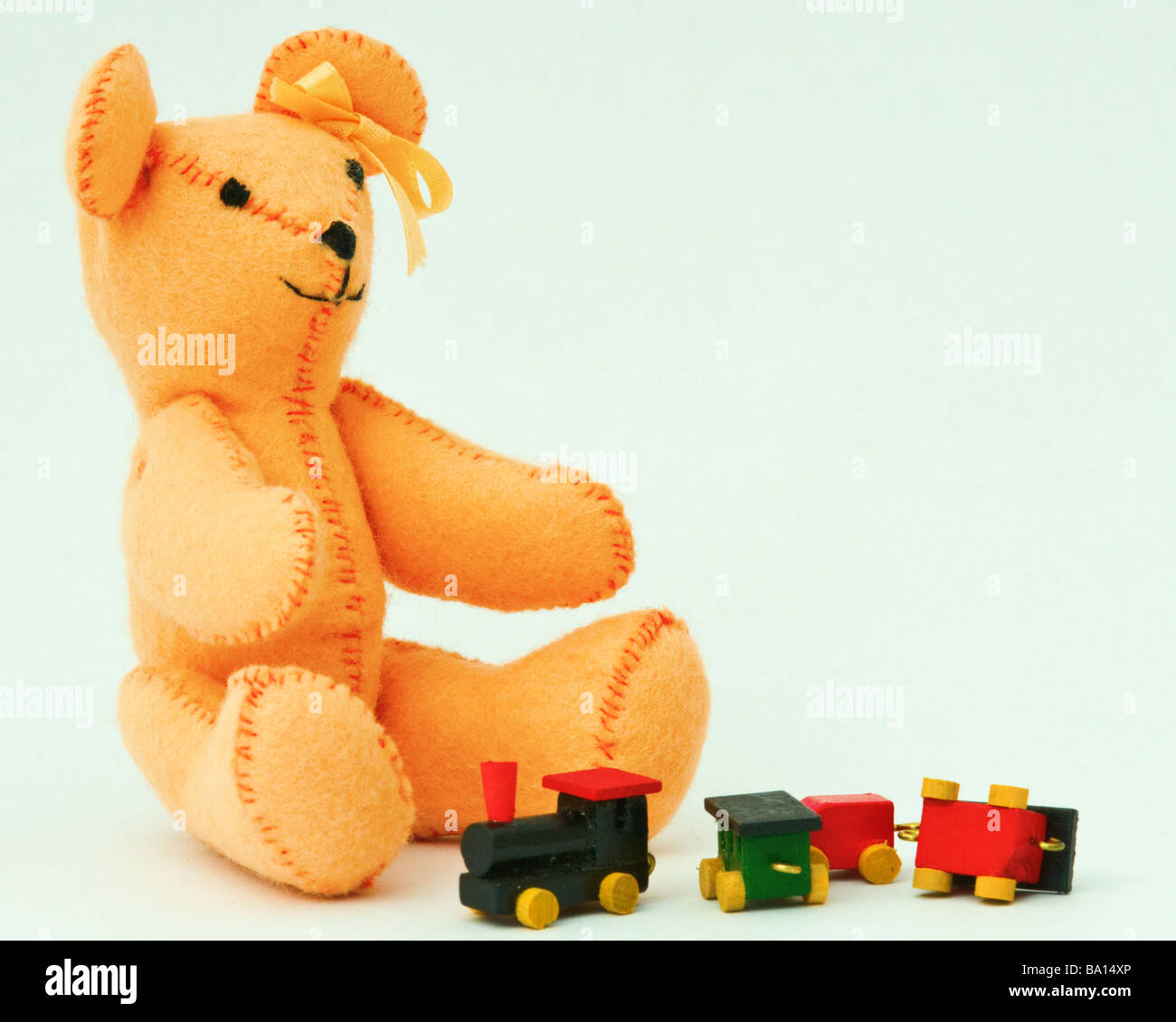 Miniature teddy playing with a train set (Mini Bear Collection Stock ...