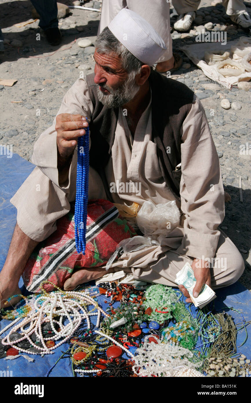 Afghan man wearing traditional hat on the transborder market near ...