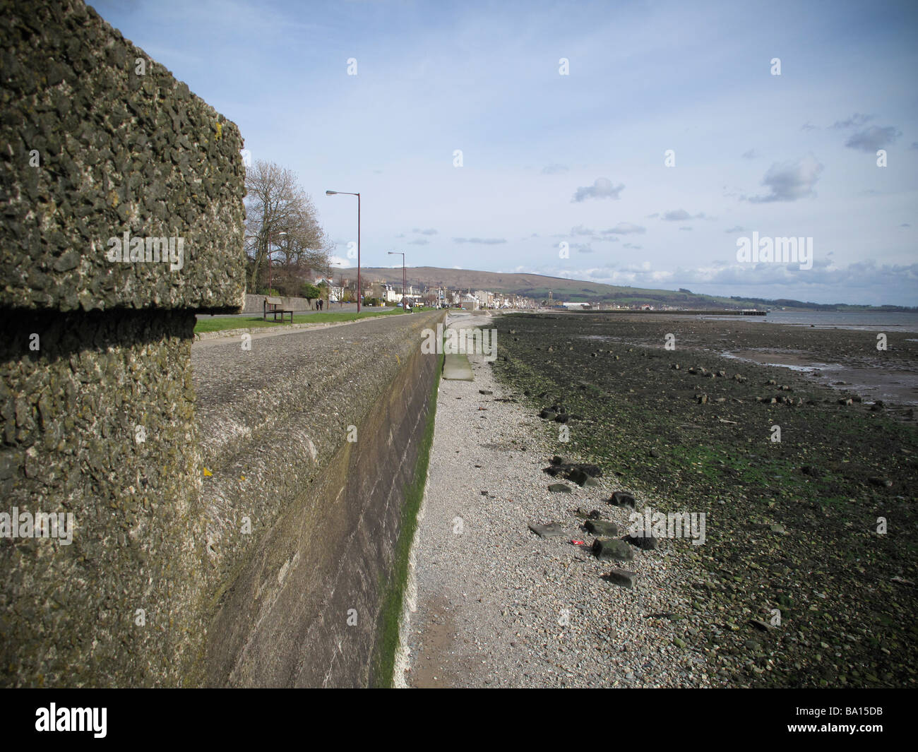 Sea wall along stoney beach front Stock Photo - Alamy