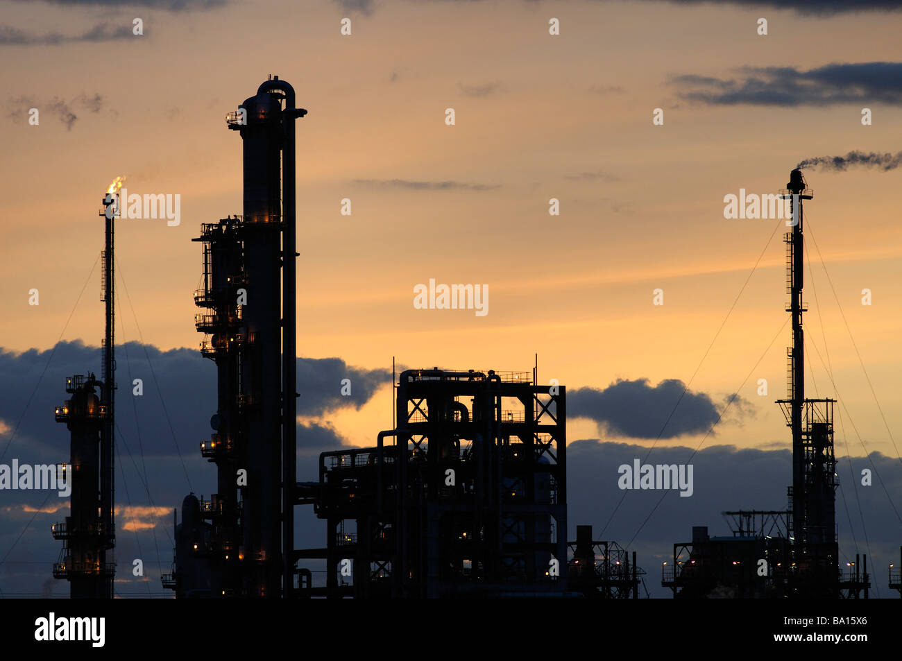 Smoke and flames billow from chimneys at the petrochemical refinery in ...