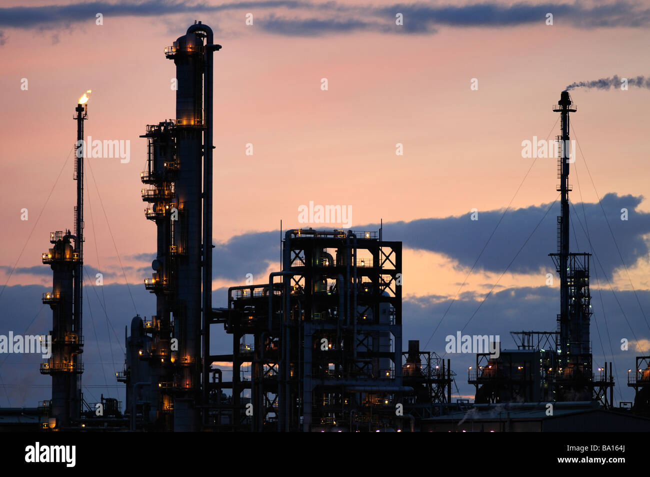 Smoke and flames billow from chimneys at the petrochemical refinery in ...