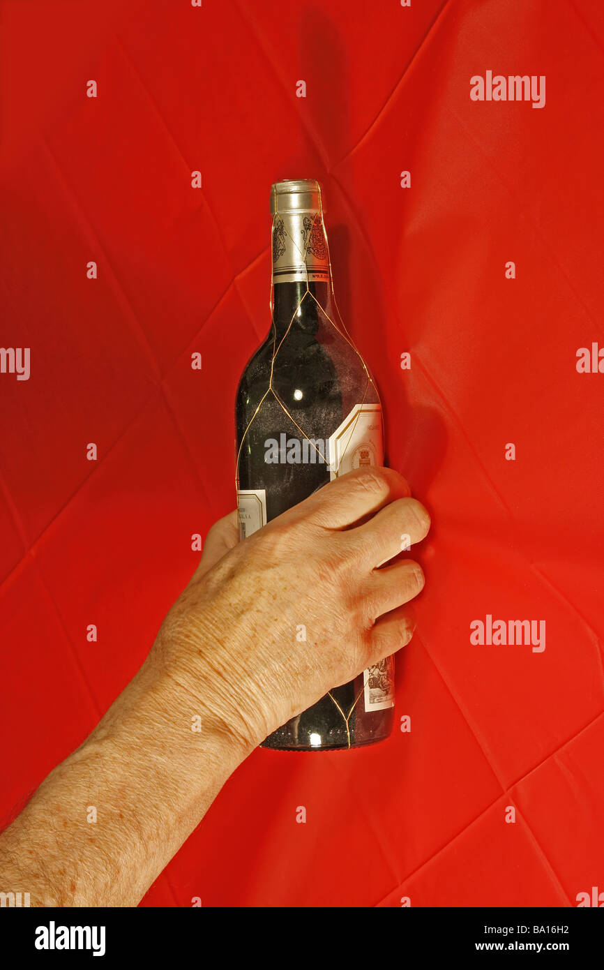 Lifting the wine bottle Stock Photo - Alamy