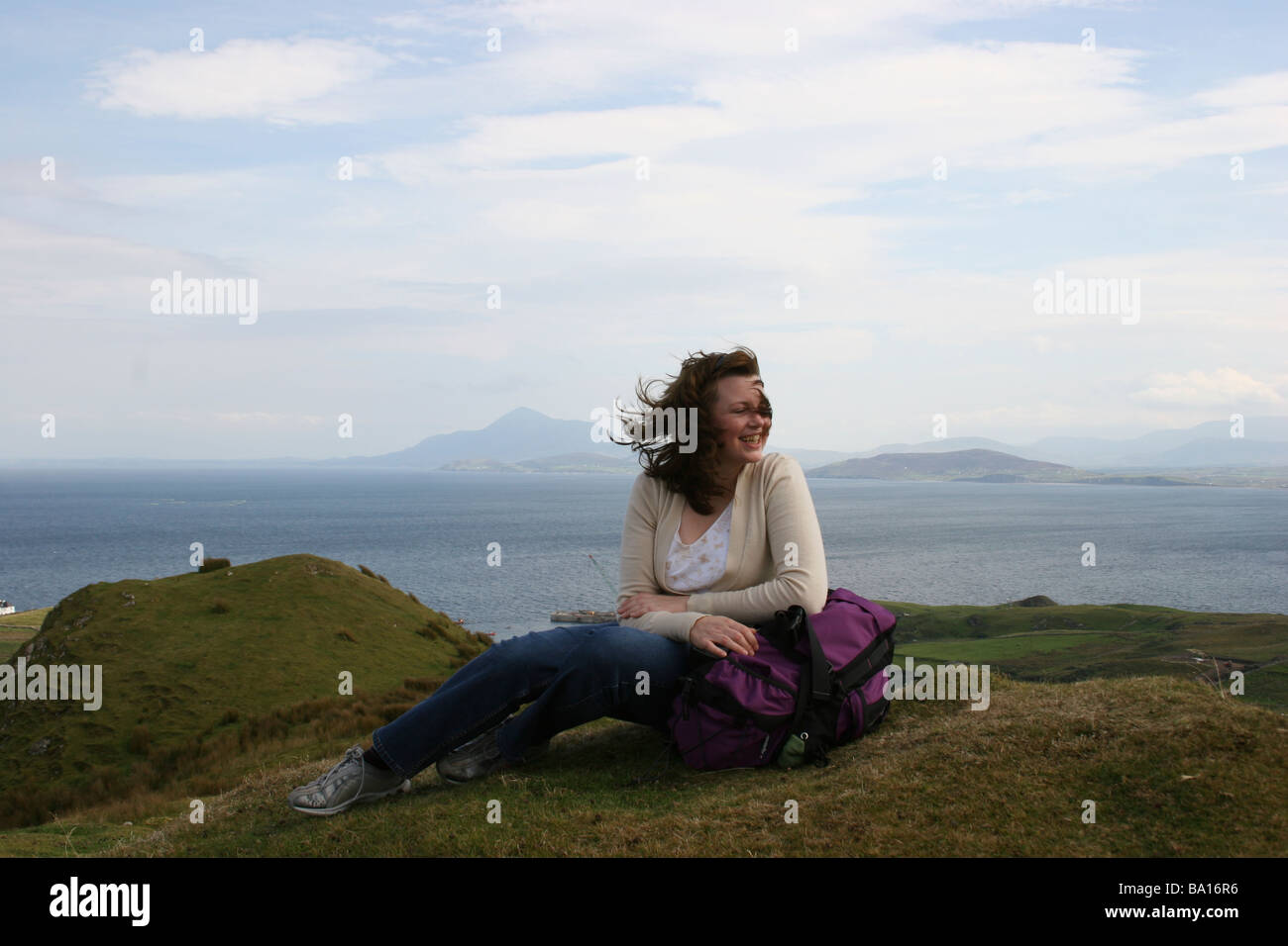 Windswept woman on mountain top Stock Photo - Alamy