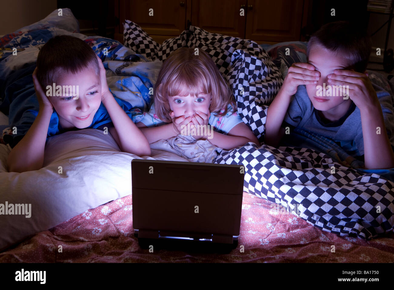 Kids watching scary movie Stock Photo - Alamy