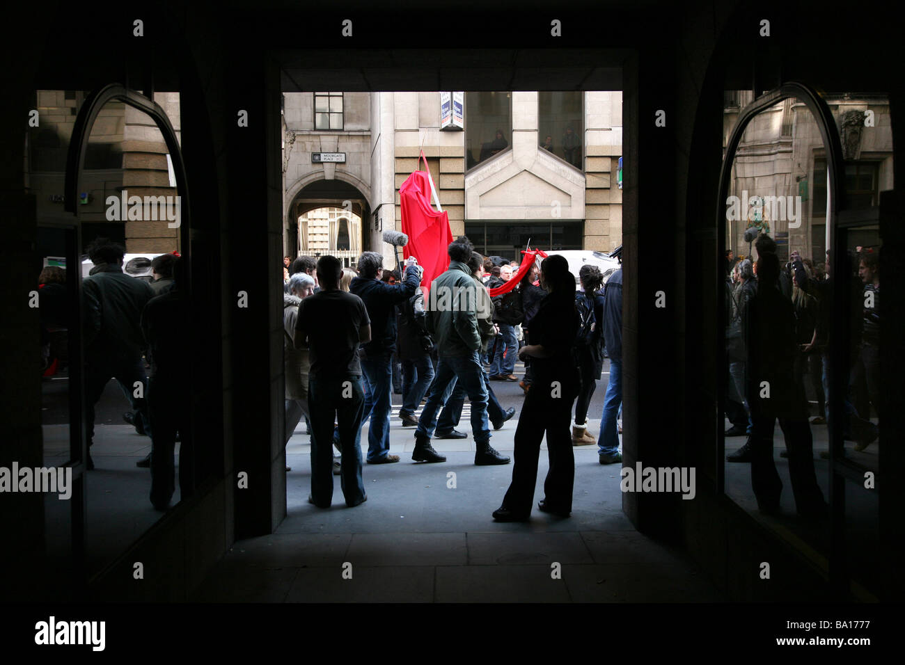 Protestors marching past an alleyway in Moorgate at the G20 protests in ...