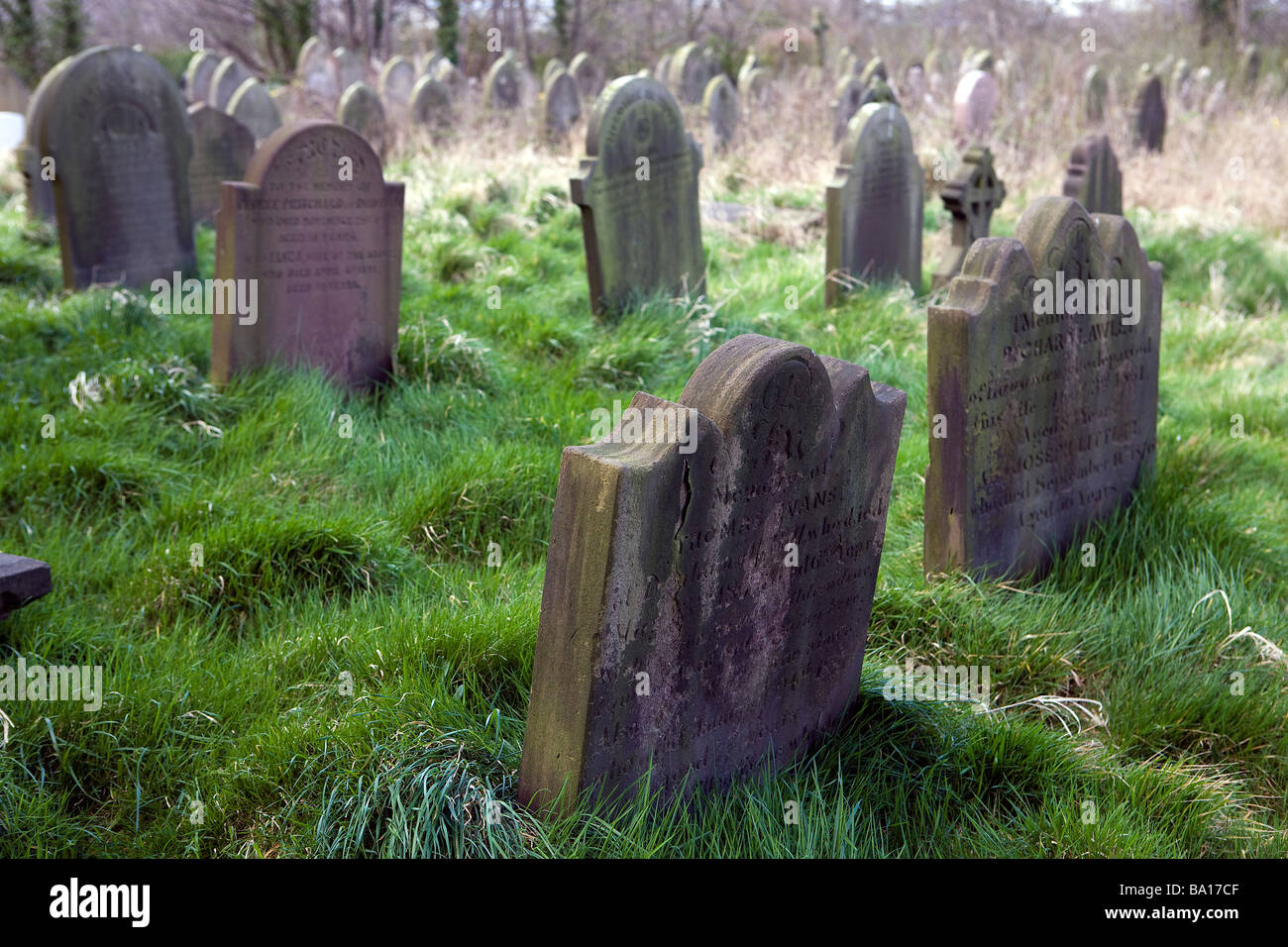 View across a grave yard showing the grave stones disappear into the ...