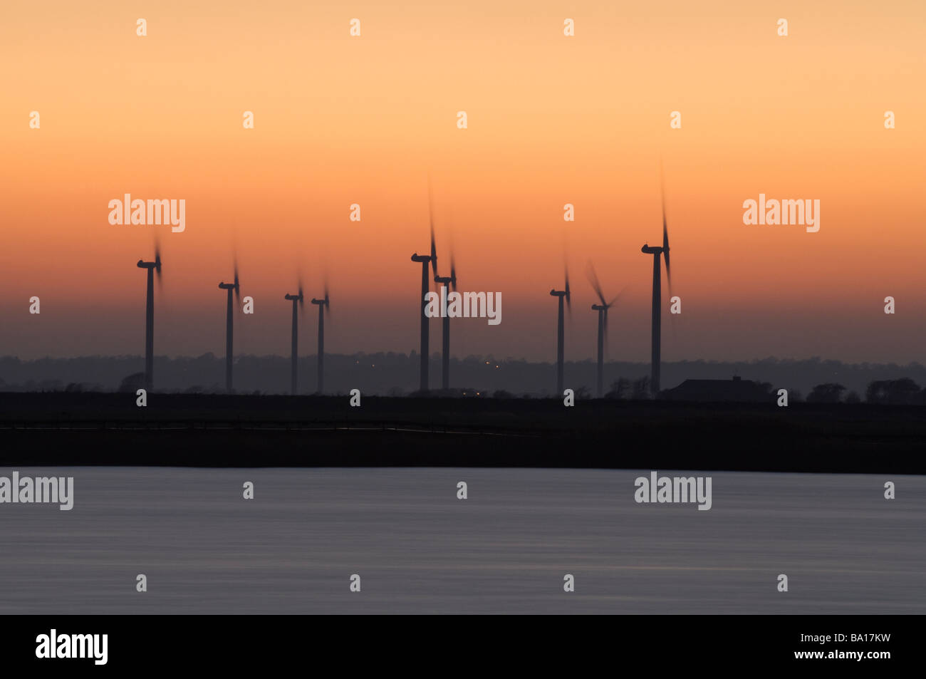Wind turbines and power pylons and lines Romney Marsh Kent UK Stock ...
