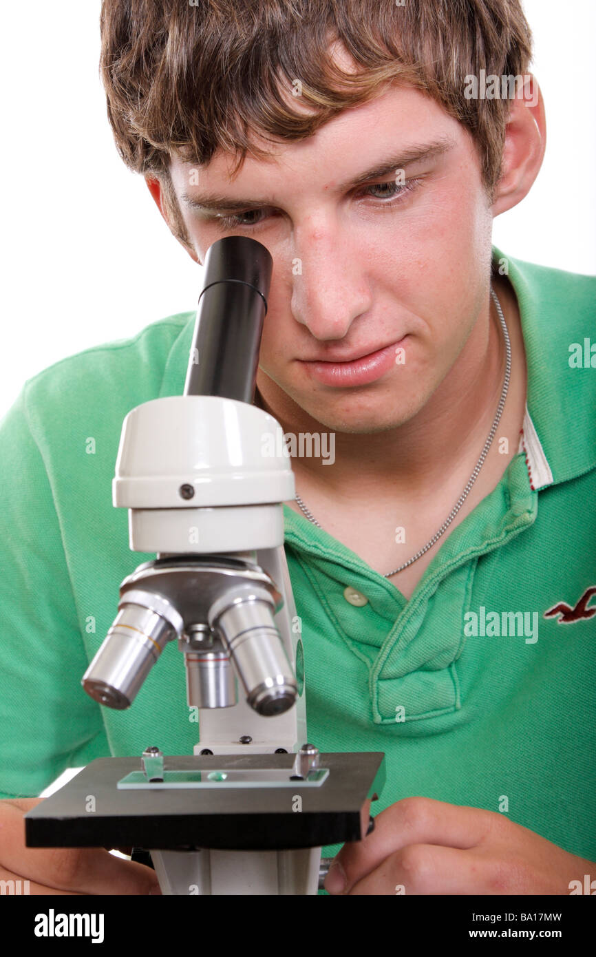 A teen student using a microscope Stock Photo - Alamy