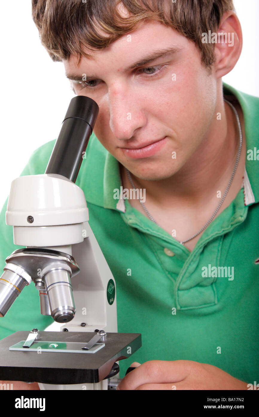 A teen student using a microscope Stock Photo - Alamy