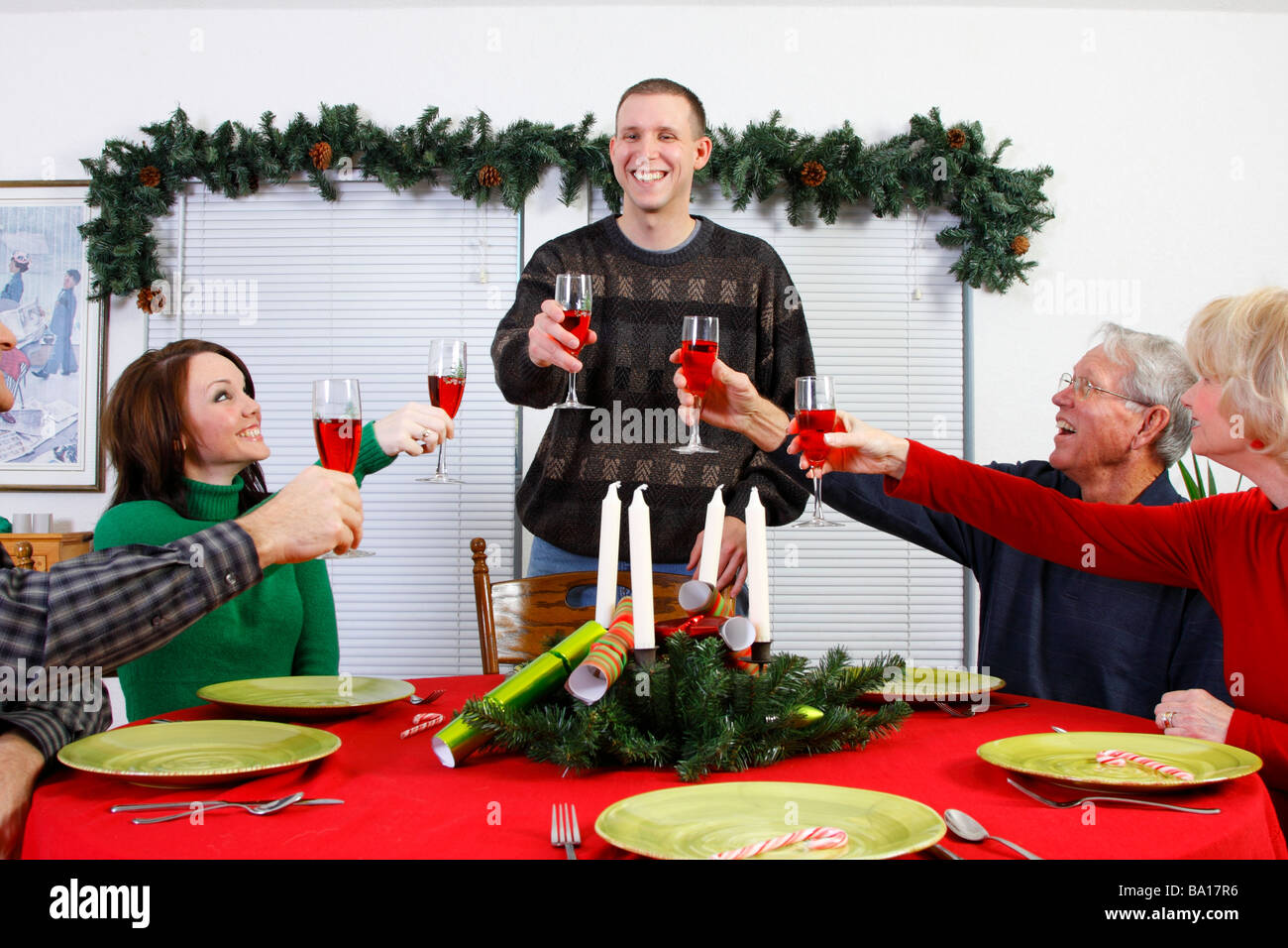 Man making a toast during Christmas dinner Stock Photo - Alamy
