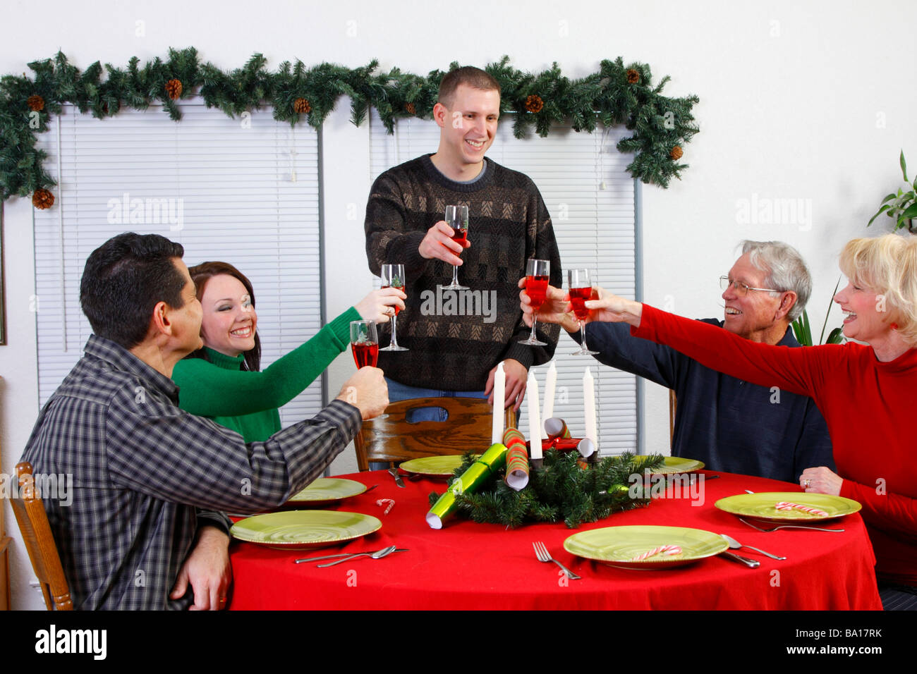 Man making a toast during Christmas dinner Stock Photo - Alamy