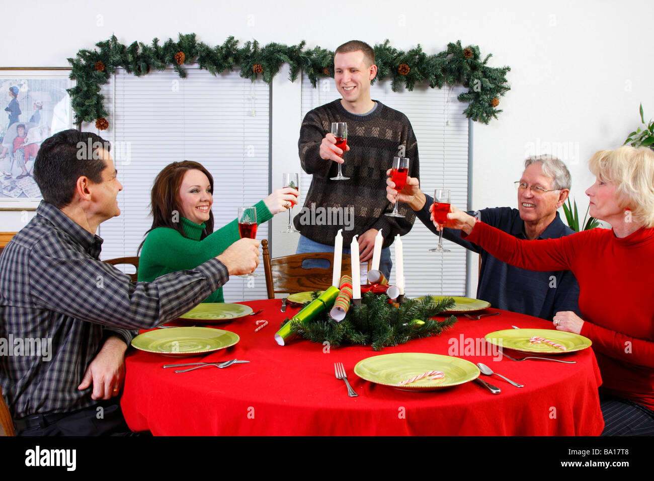Man making a toast during Christmas dinner Stock Photo - Alamy