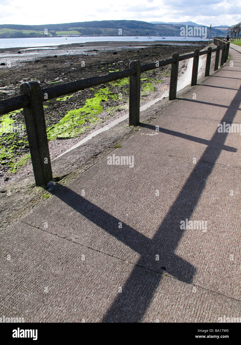railing and high contrast shadows on path Stock Photo - Alamy