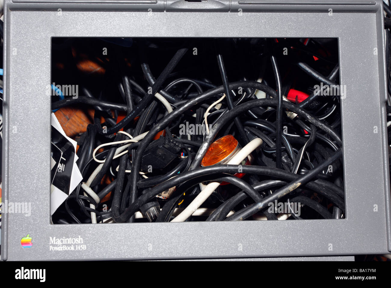 Mac Powerbook screen dissembled with wires behind Stock Photo - Alamy