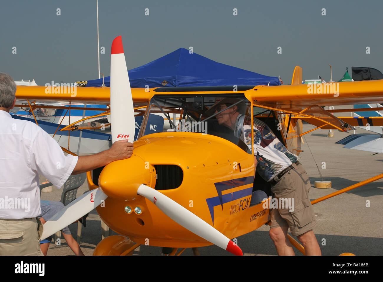 Man Investigating a Euro Fox Light Sport Airplane Displayed at Dayton ...