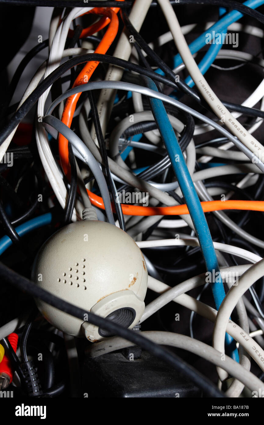 Tangled wires of various colors and an obsolete webcam ballcam camera ...