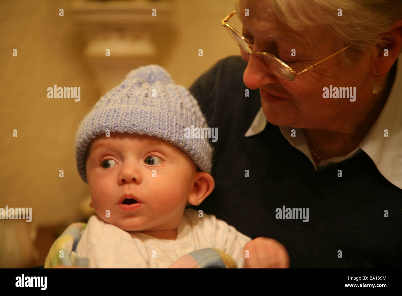Baby and older relative Stock Photo - Alamy