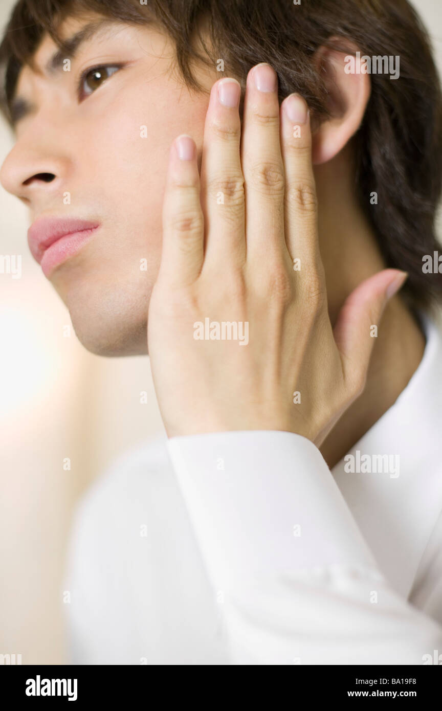 Young businessman worrying about his beards Stock Photo - Alamy