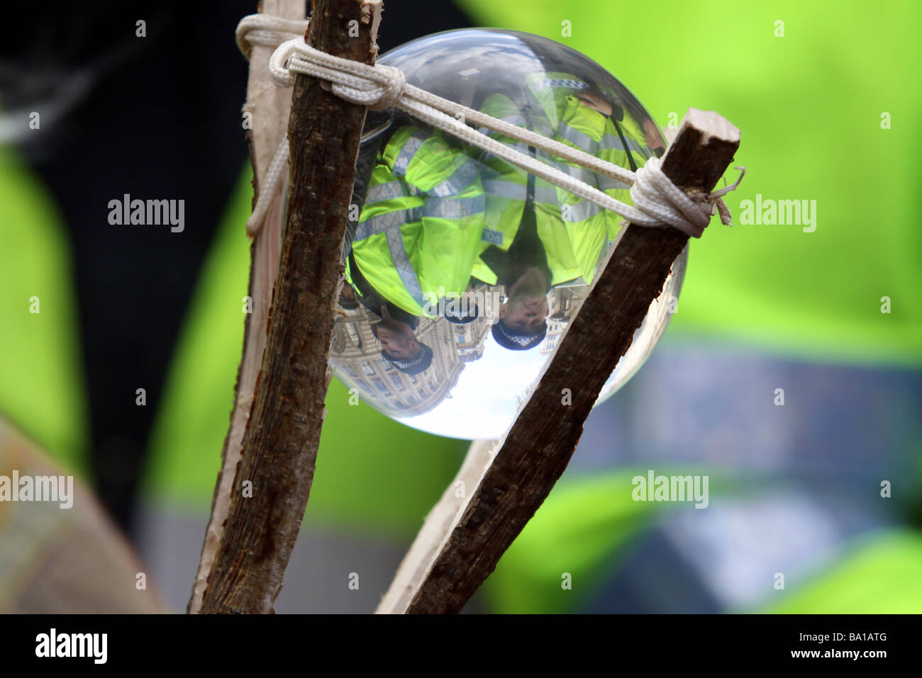 Police officers viewed through a protestors crystal ball at the G20 ...
