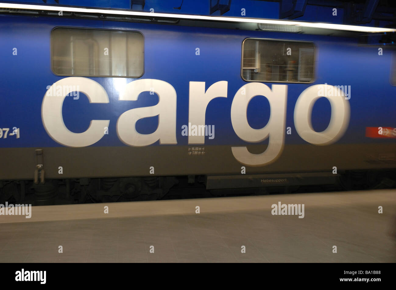 A freight train with Cargo written on the side racing through Zurich ...