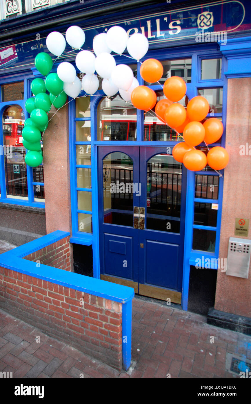 Helium balloons floating above the entrance to an Irish bar in Richmond ...
