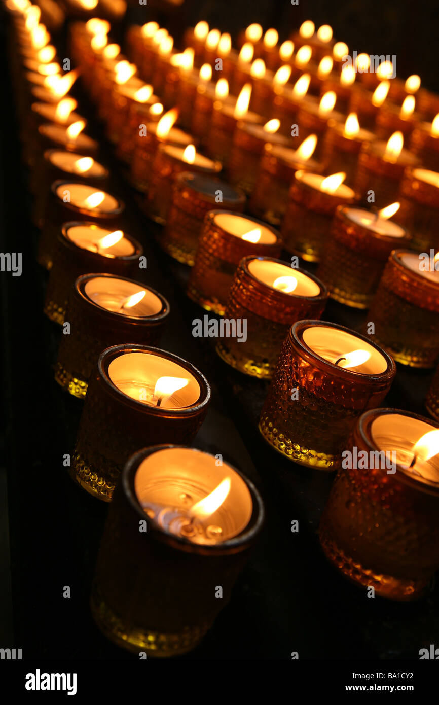 Burning candles an one is off Stock Photo - Alamy